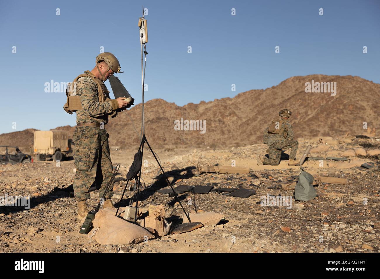 U.S. Marine Corps Sgt. Dallas Vandenberg, left, an intelligence ...