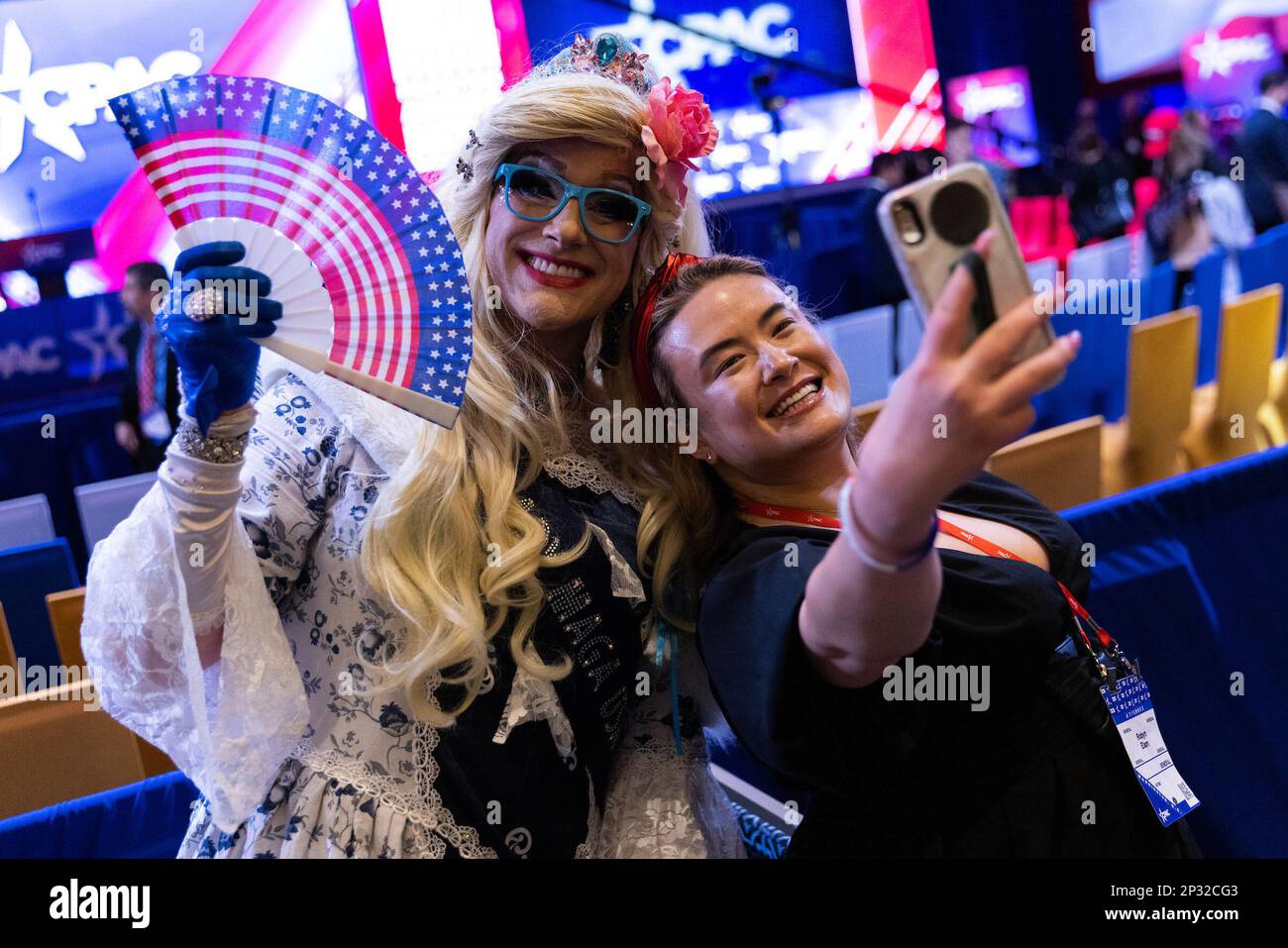 Ryan Woods, known as "Lady Maga", takes photos with a 2023 Conservative ...