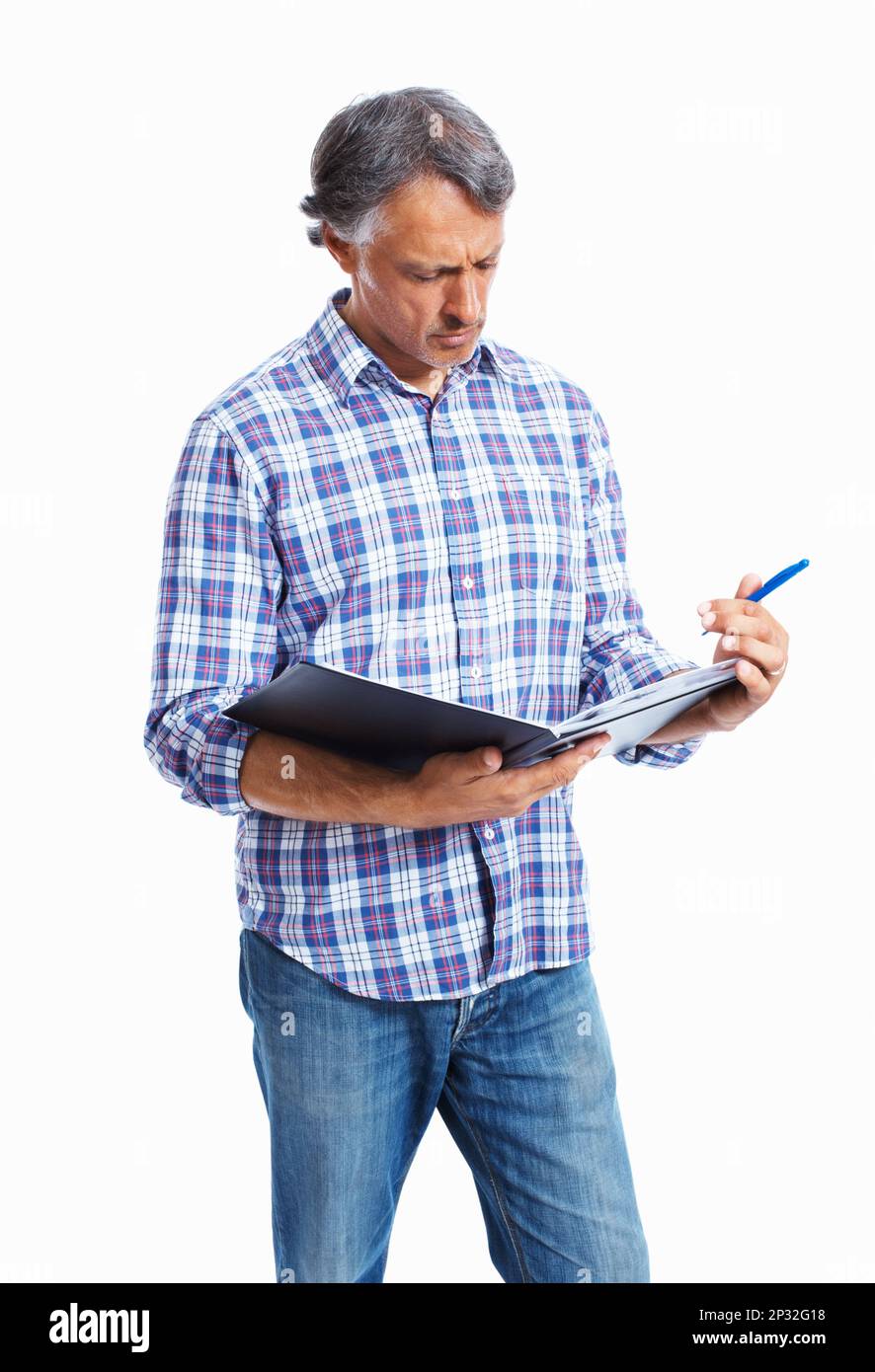 Business man going through documents. Mature business man going through ...