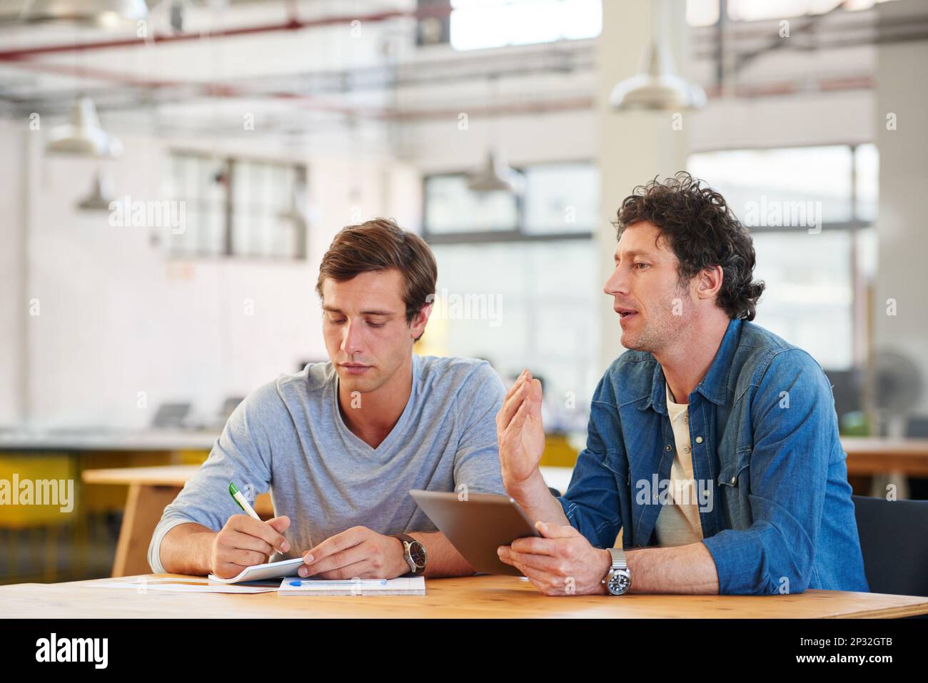 Transforming his verbal ideas into written form. colleagues ...