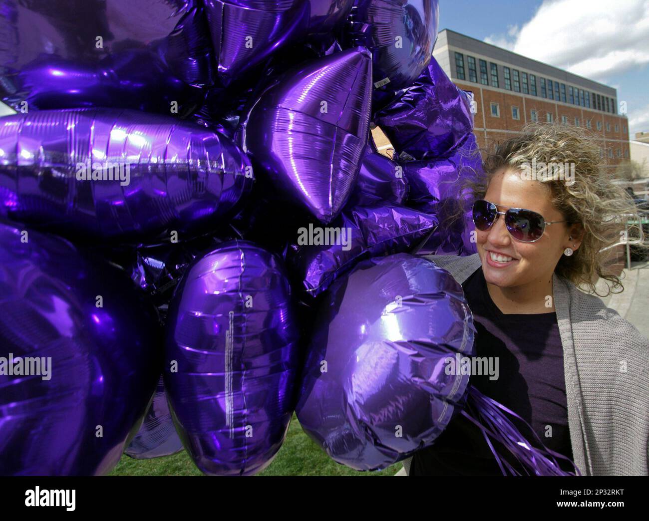 Kristen Maslar of Eynon, PA is enveloped by wind blown balloons as ...