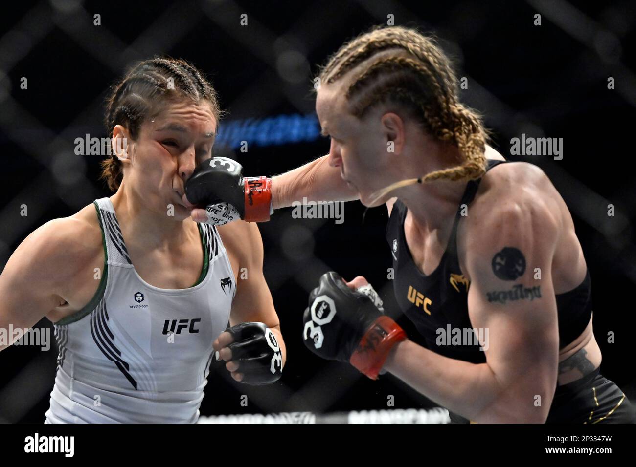Alexa Grasso, left, is hit by Valentina Shevchenko during a UFC 285 ...
