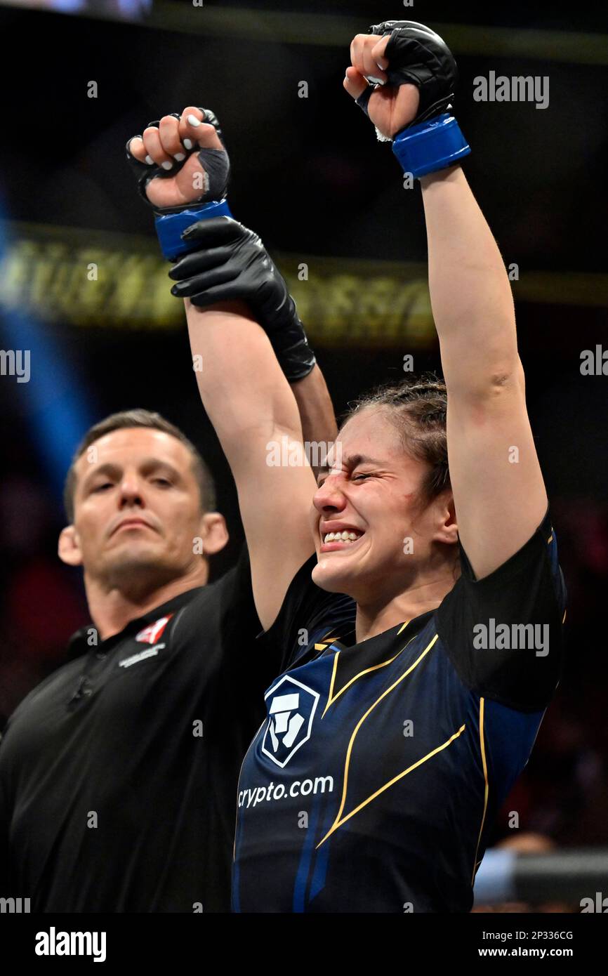 Alexa Grasso raises her arms after defeating Valentina Shevchenko in a ...