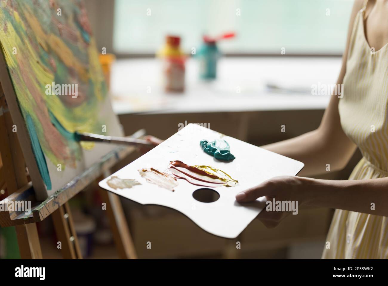 Artist using craft palette for drawing picture Stock Photo - Alamy
