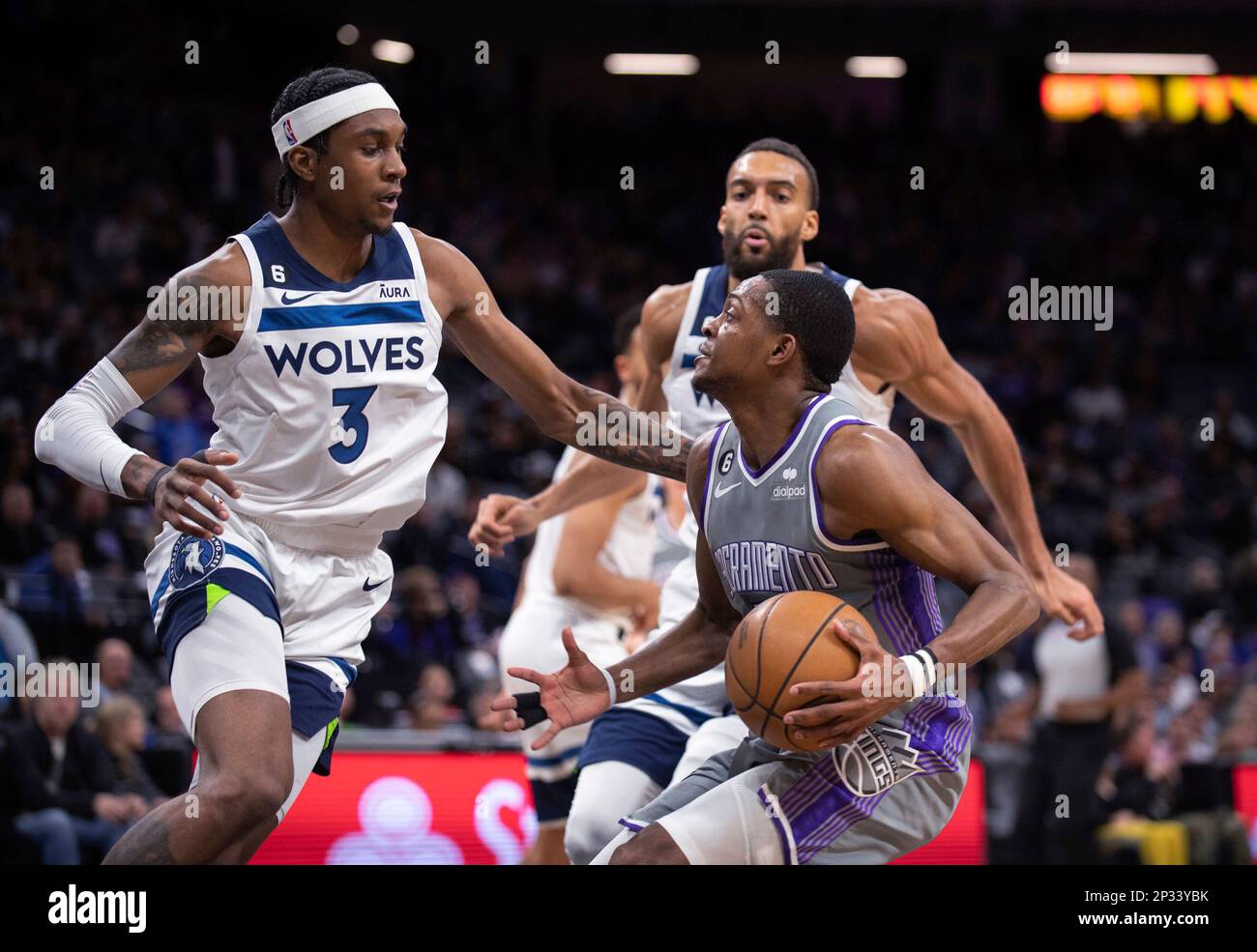 Minnesota Timberwolves forward Jaden McDaniels (3) and center Rudy Gobert (27) double-team ...