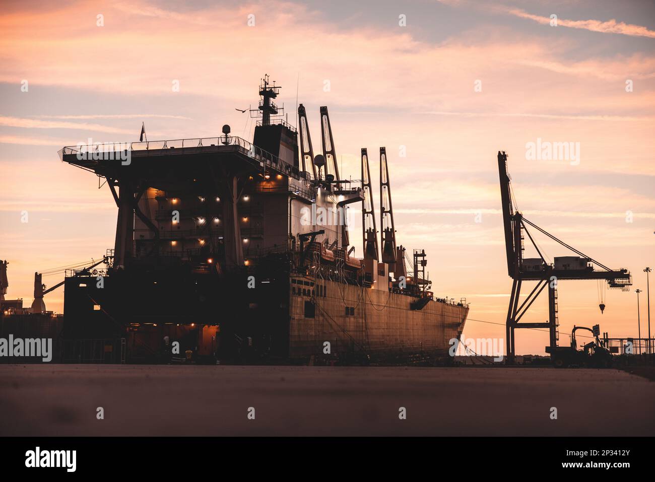 The USNS Bobo (AK-3008) is prepped for a pier side offload to conduct ...