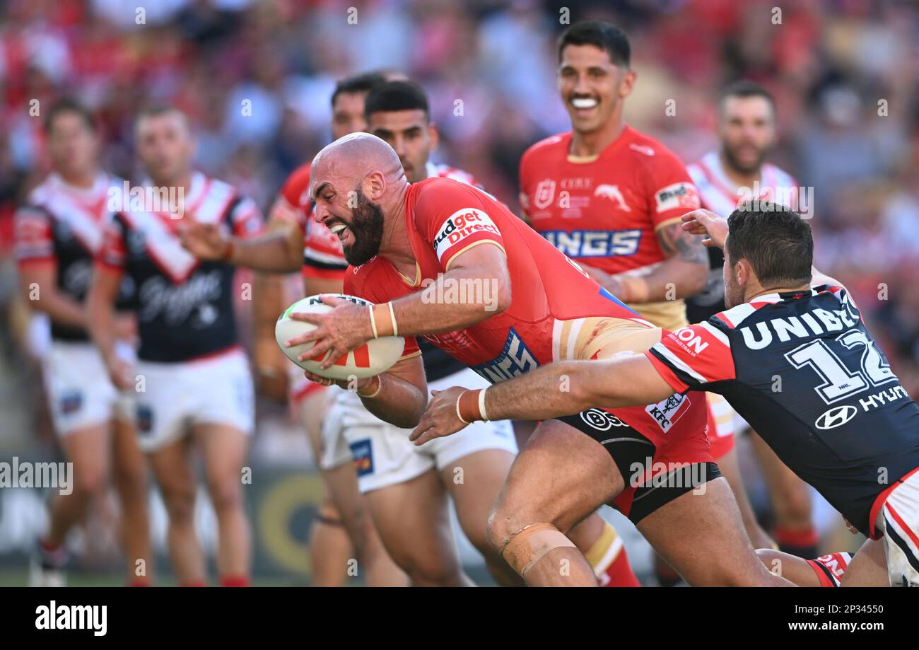 Mark Nicholls of the Dolphins scores a try during the NRL Round 1 match ...