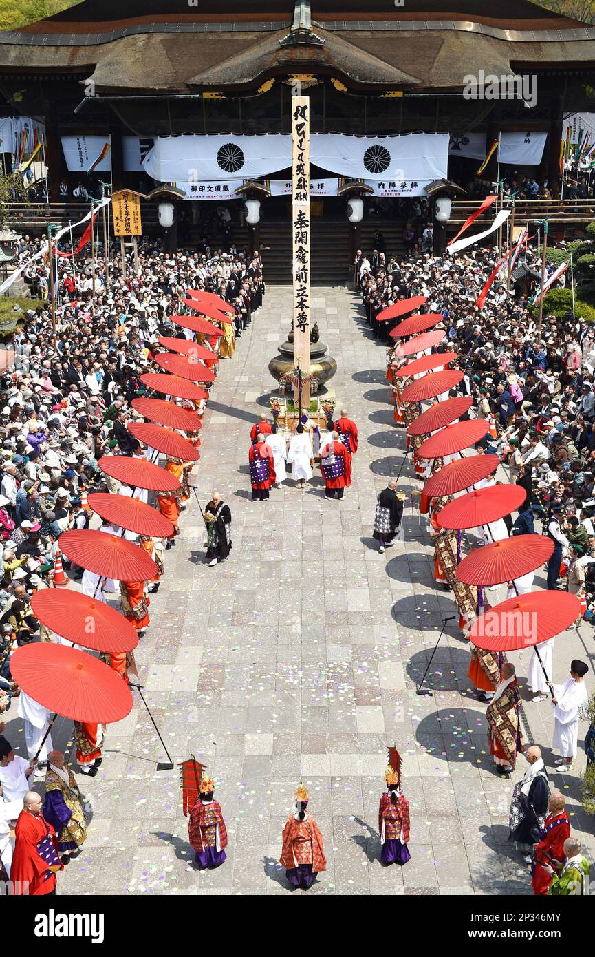 Priests advance toward the main hall of Zenkoji temple in Nagano during ...