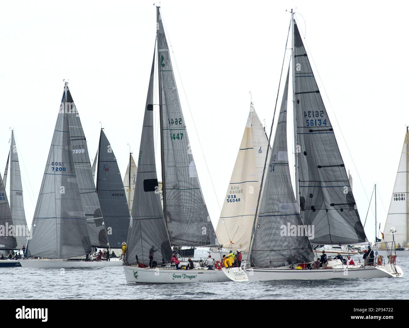 Skipper Bob Keltenfofen and his crew of Dare (7200), left, races ...