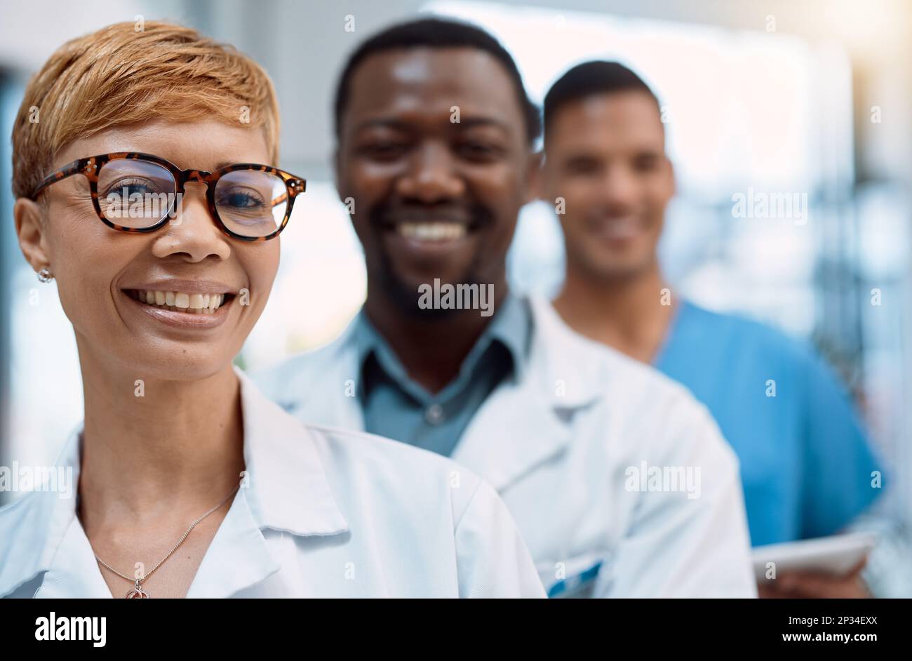 Black woman, portrait and doctors smile for teamwork, healthcare leadership and hospital ...