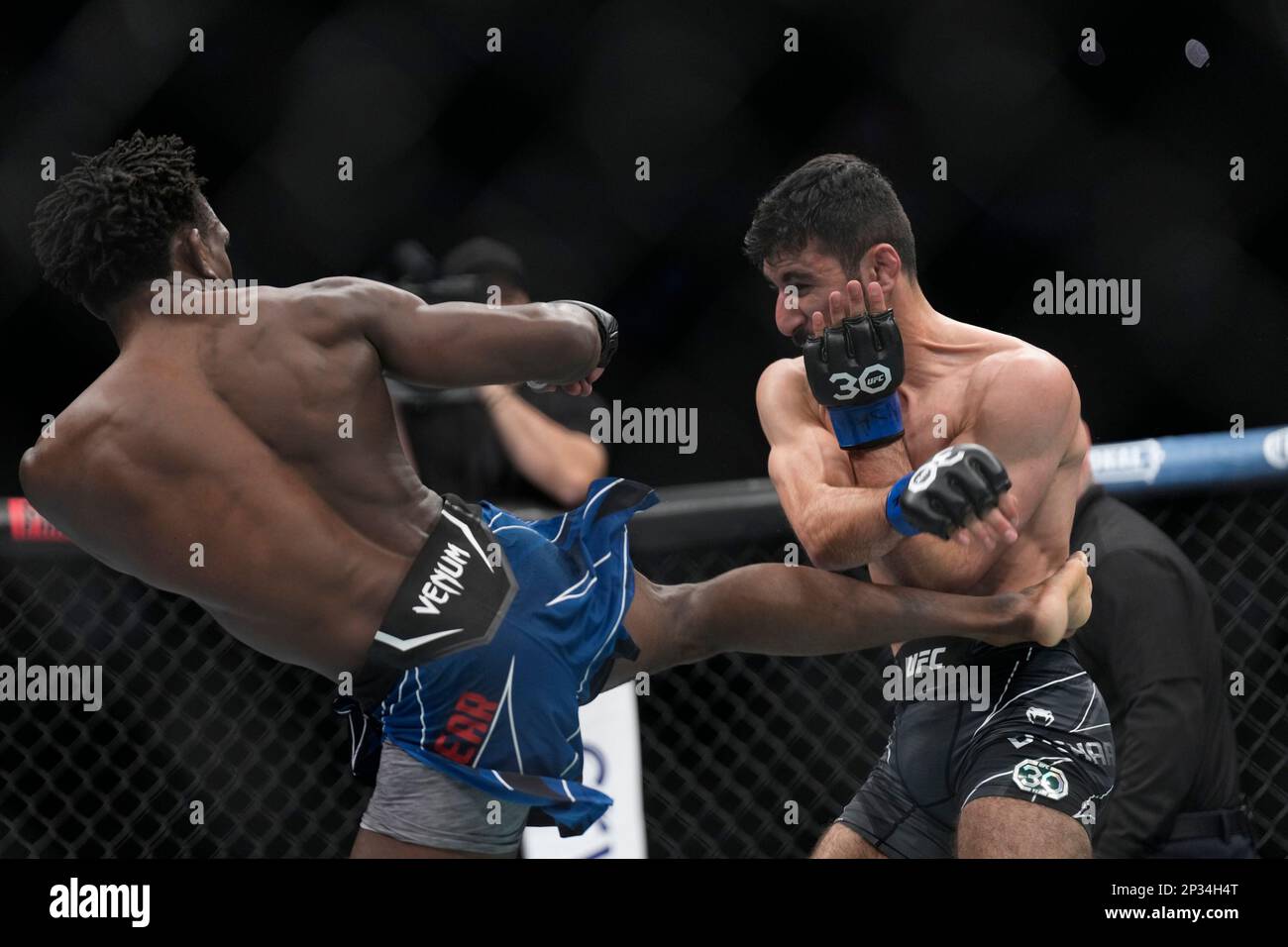 LAS VEGAS, NV - MARCH 4: (L-R) Da'Mon Blackshear kicks Farid Basharat in their Bantamweight ...