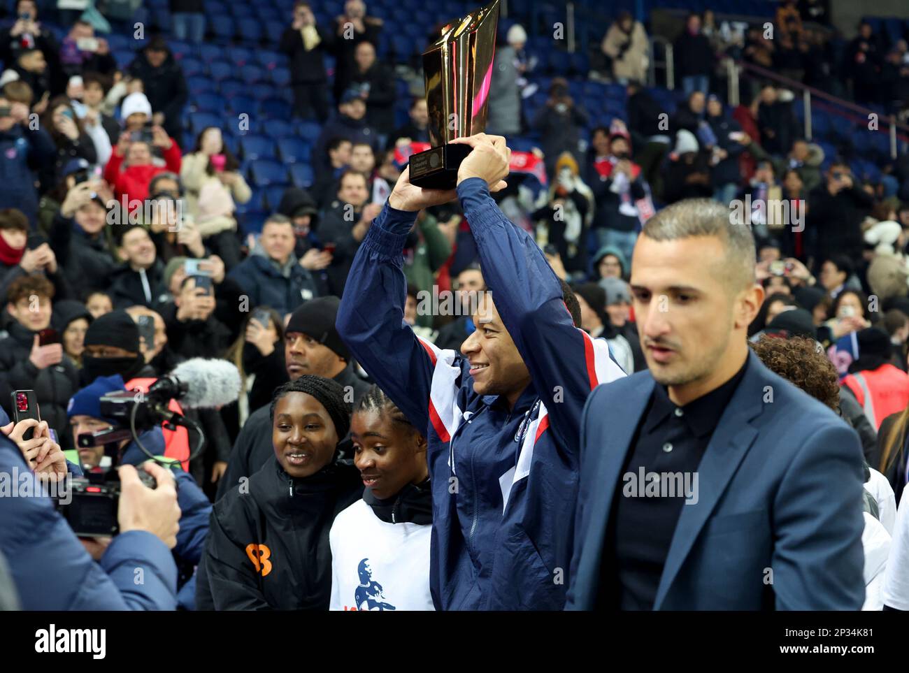 Kylian Mbappe of PSG receives a trophy celebrating his 201st goal for ...