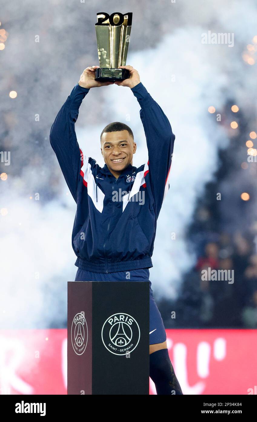 Kylian Mbappe of PSG receives a trophy celebrating his 201st goal for ...