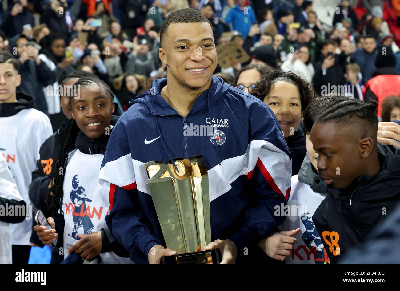 Kylian Mbappe of PSG receives a trophy celebrating his 201st goal for ...