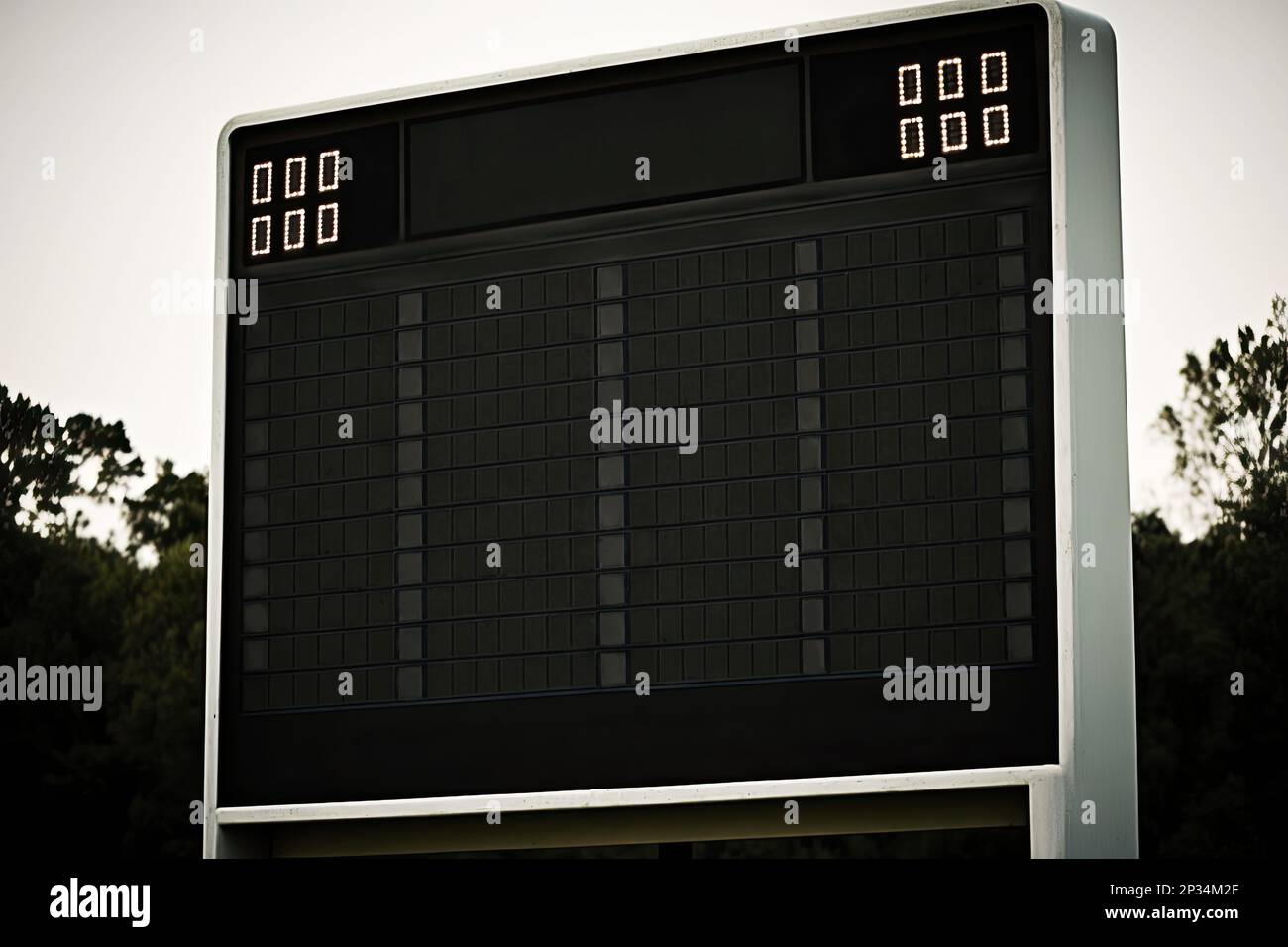 empty scoreboard for sports against a background of the sky and ...