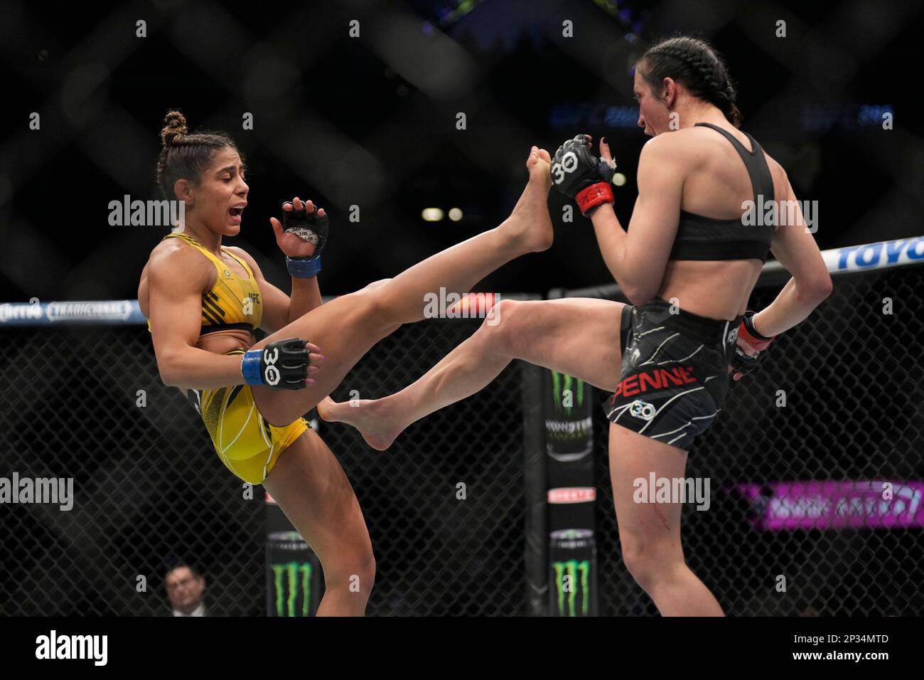 LAS VEGAS, NV - MARCH 4: (R-L) Jessica Penne battles Tabatha Ricci in their Women's Strawweight ...