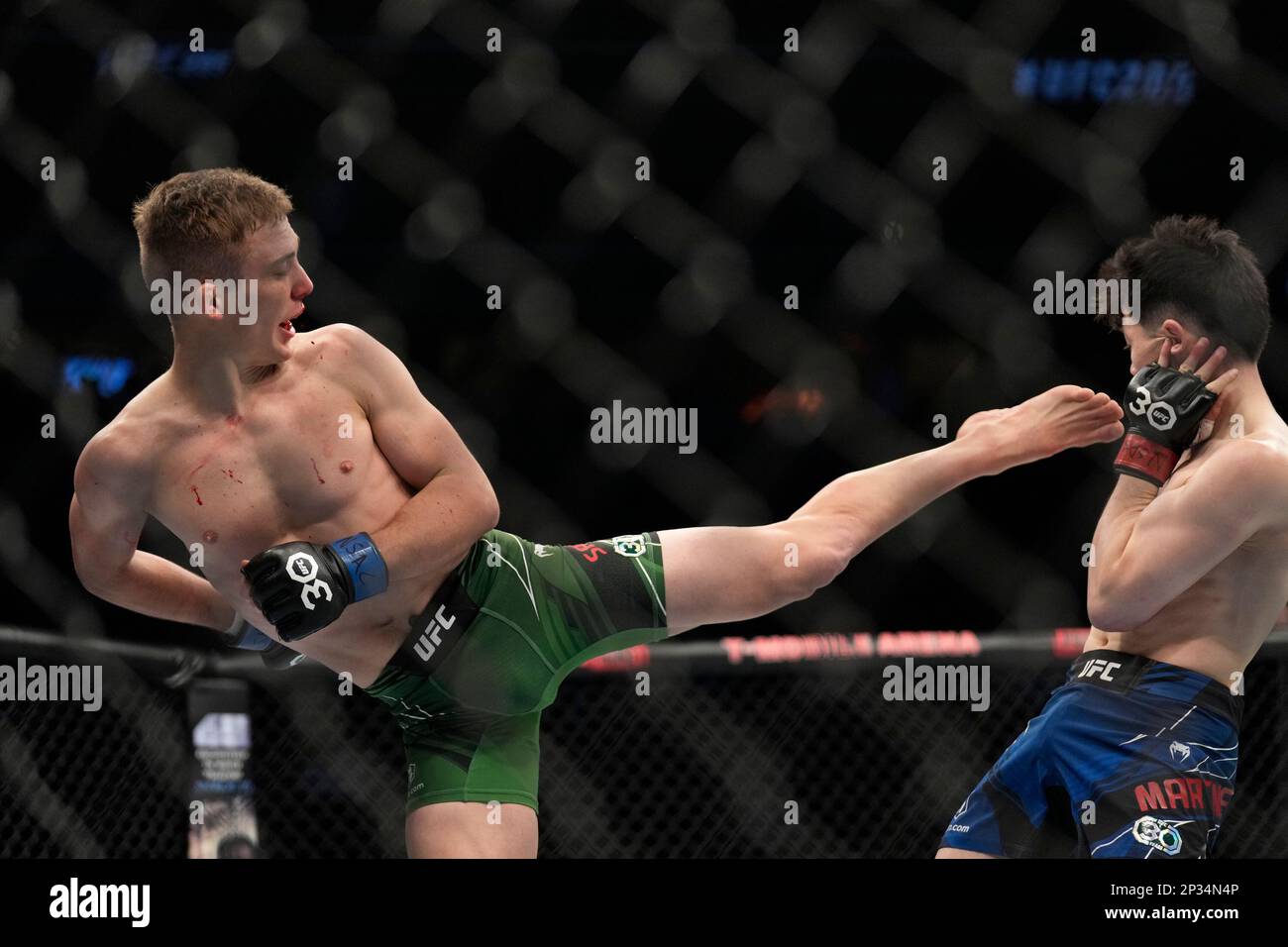 LAS VEGAS, NV - MARCH 4: (L-R) Cameron Saaiman kicks Mana Martinez in ...