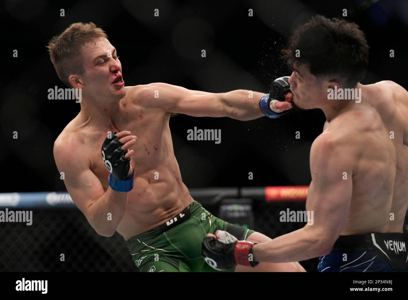 LAS VEGAS, NV - MARCH 4: (L-R) Cameron Saaiman punches Mana Martinez in ...
