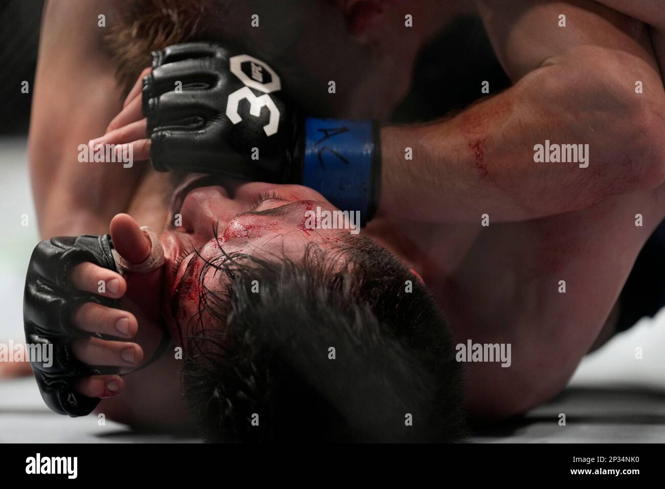 LAS VEGAS, NV - MARCH 4: Cameron Saaiman (top) controls the body of ...