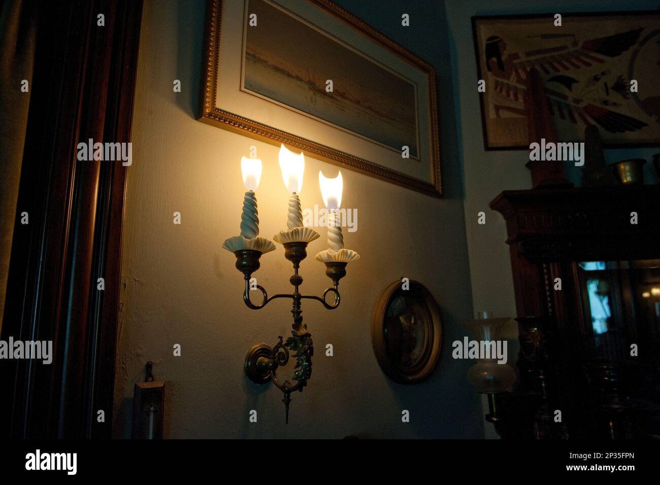A gas wall lamp burns in the home of Dan Mattausch expert in historic ...