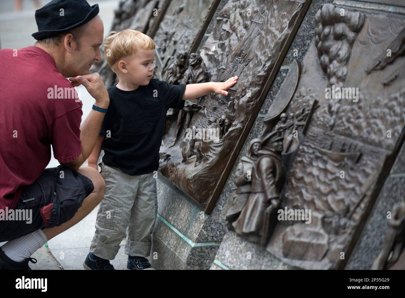 Ian MacKaye of Mount Pleasant, and his son Carmine, 2, check out the U ...
