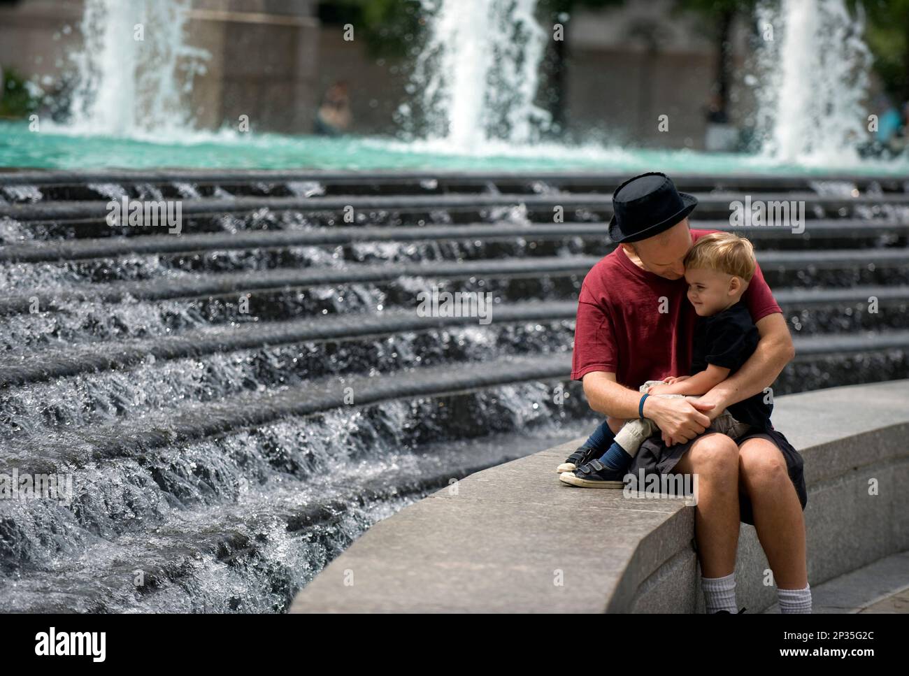 Ian MacKaye of Mount Pleasant, and his son Carmine, 2, relax at the U.S ...