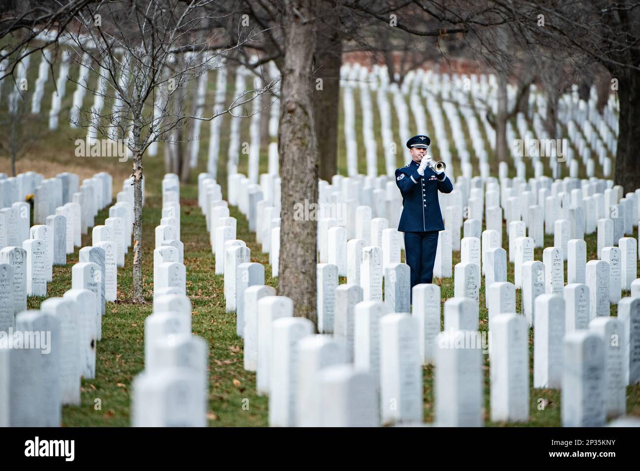 A bugler from the U.S. Air Force Ceremonial Brass Band plays "Taps ...
