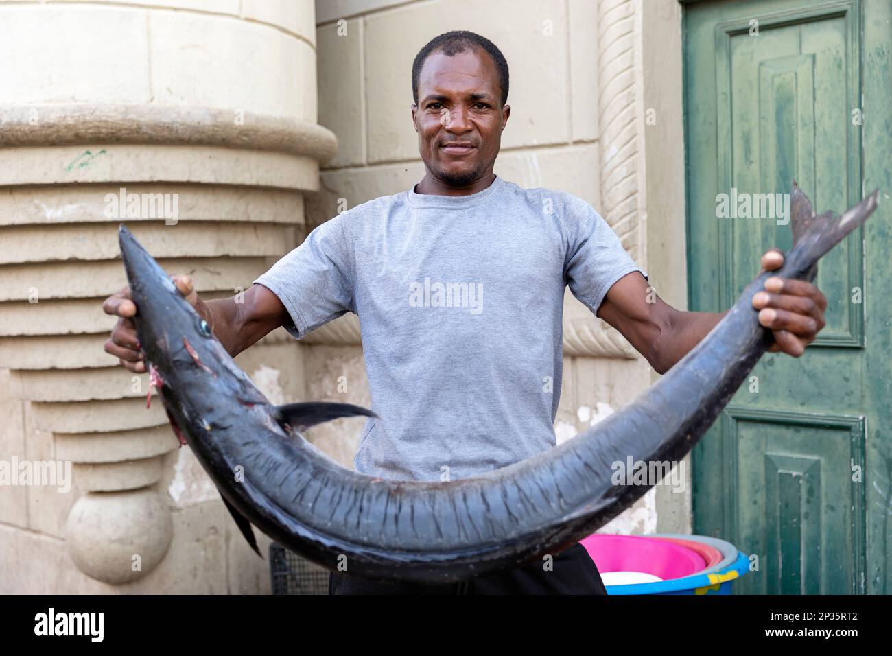 Local men, fisherman showing and selling big daily catch, barracuda ...