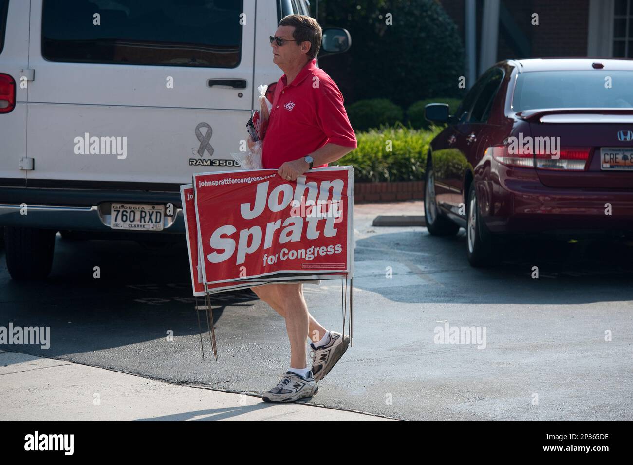 UNITED STATES - AUGUST 28 : A John Spratt campagin workers carries ...