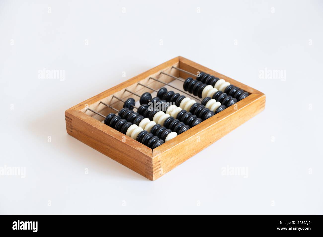Old wooden abacus for counting money on a white background close-up ...