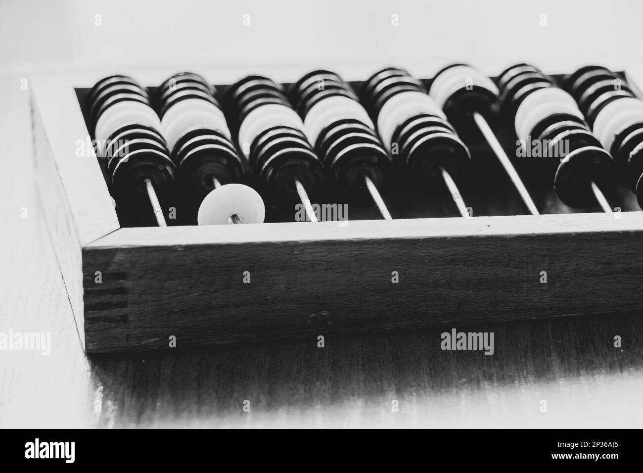 Old wooden abacus for counting money on a wooden table close-up black ...