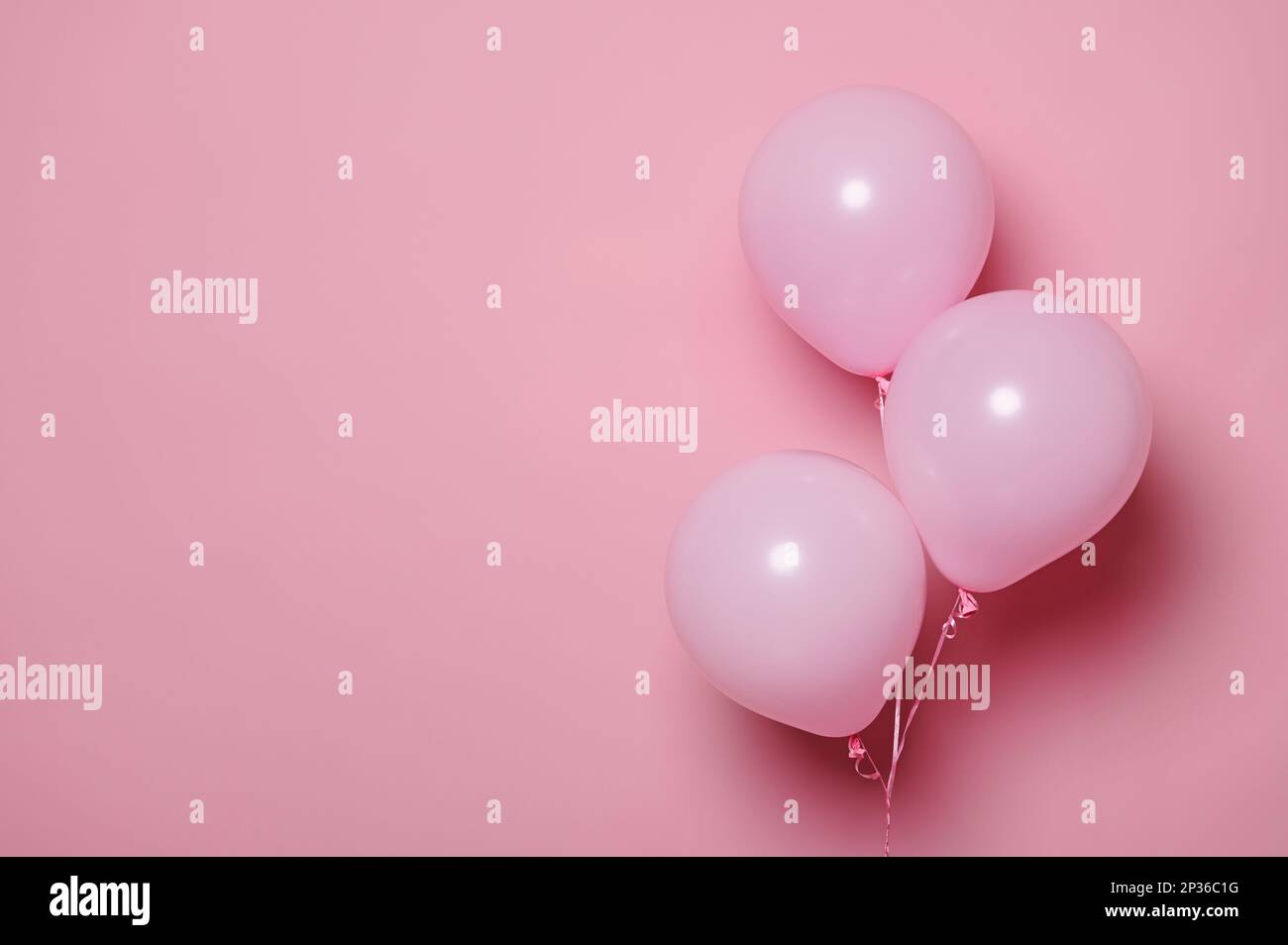 Three pink pastel inflatable air balls, helium balloons on isolated ...