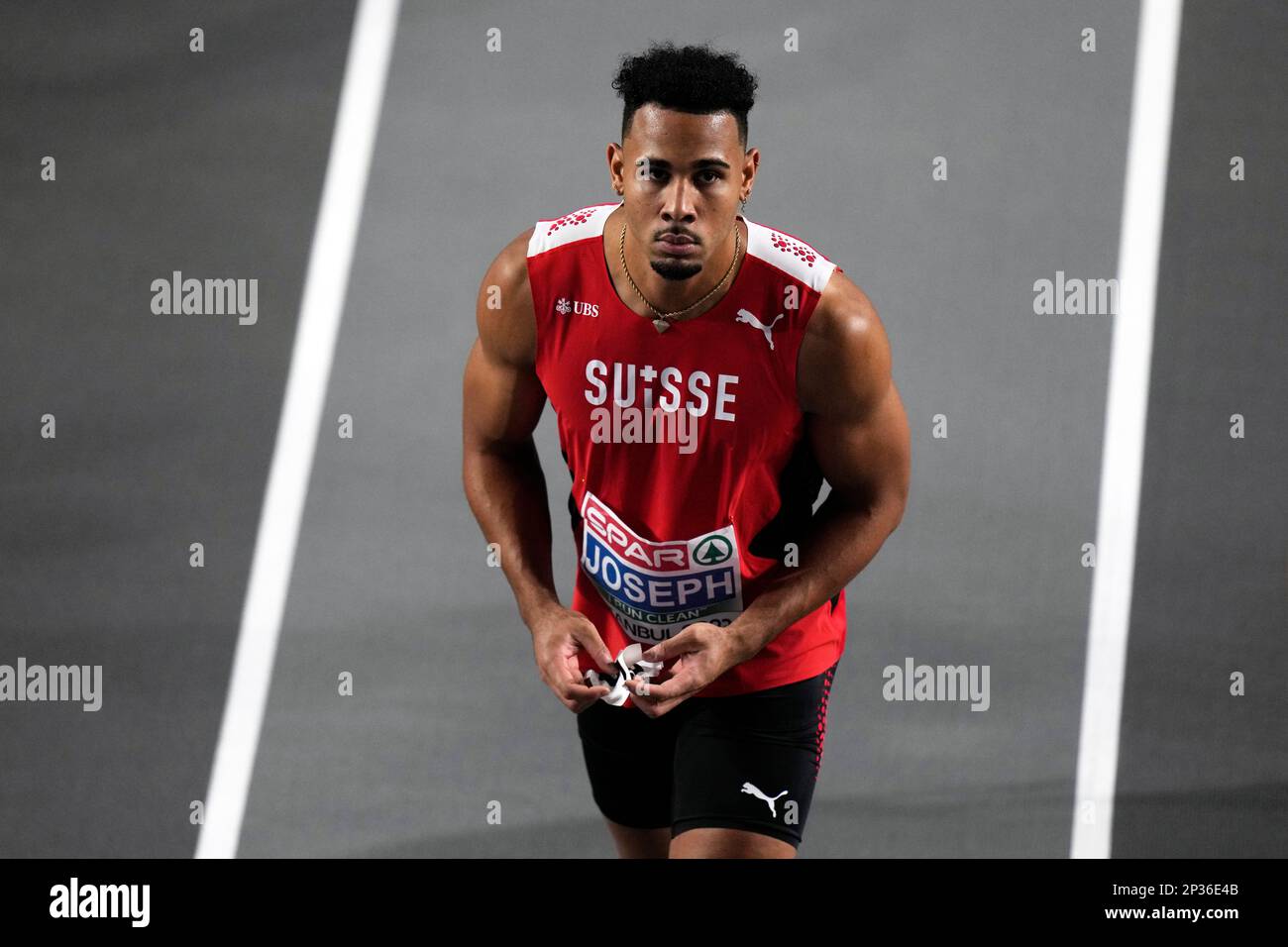 Jason Joseph, of Switzerland, looks up after finishing a Men 60 meters ...