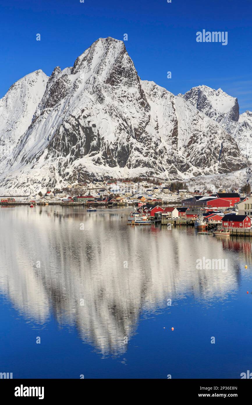 Village view Reine, winter, in the back snow-covered mountain Olstinden ...