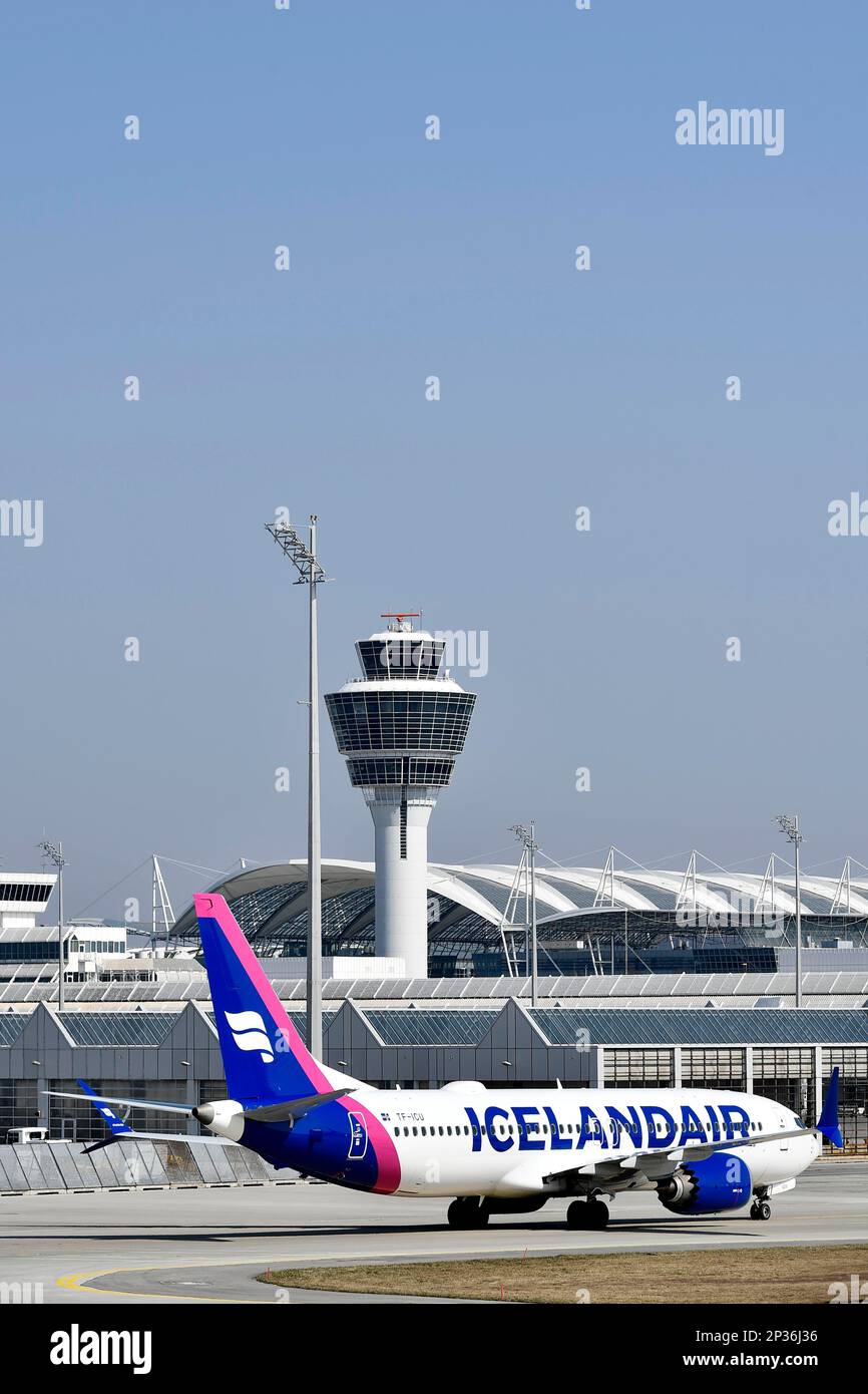 Iceland Air aircraft Boeing B737 MAX taxiing with Terminal 1 and Tower ...