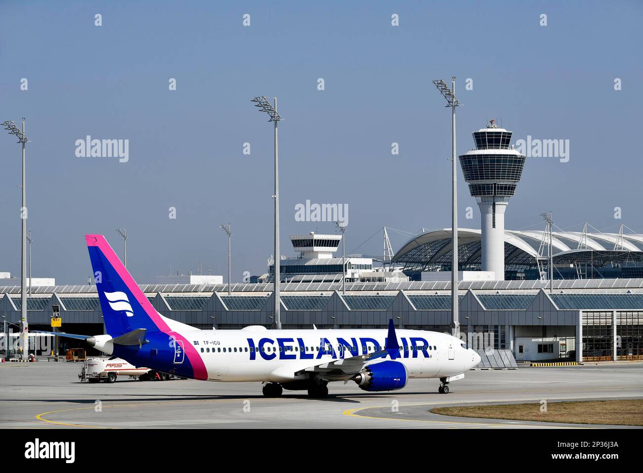 Iceland Air aircraft Boeing B737 MAX taxiing with Terminal 1 and Tower ...