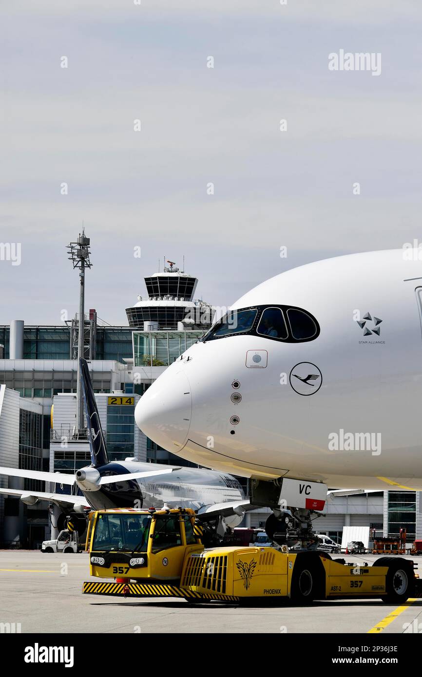 Lufthansa Airbus A350-900 towing with push-back truck in front of ...