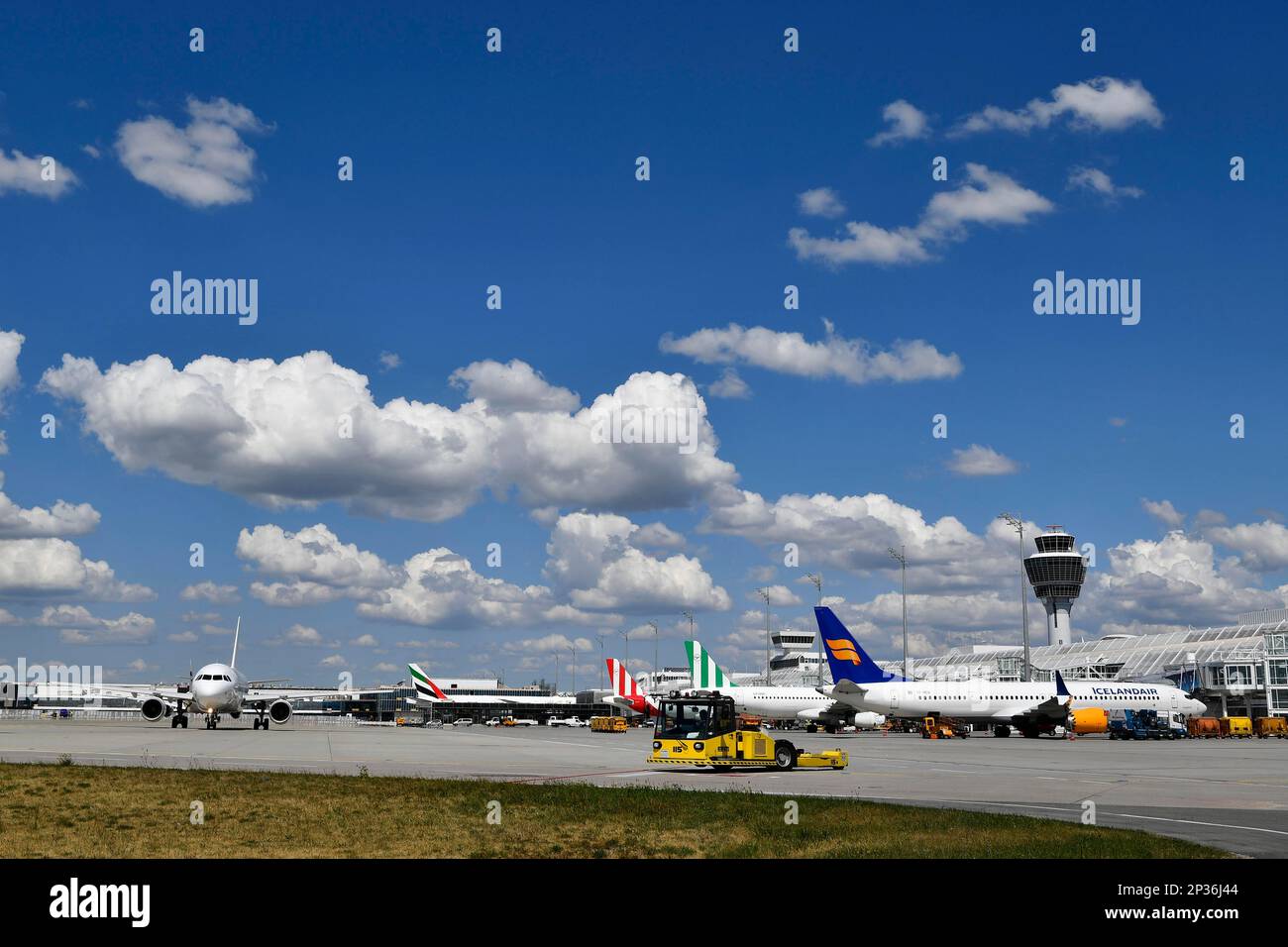 Aircraft parking on position at Terminal 1 with tower, ICELANDAIR ...