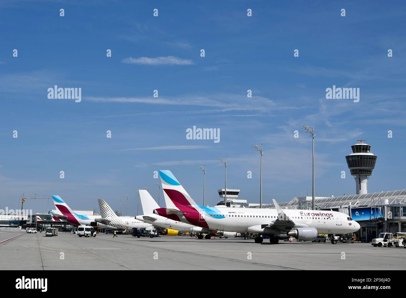 Aircraft parking on position at Terminal 1 with tower, Eurowings ...