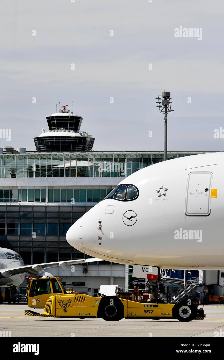 Lufthansa Airbus A350-900 towing with push-back truck in front of ...