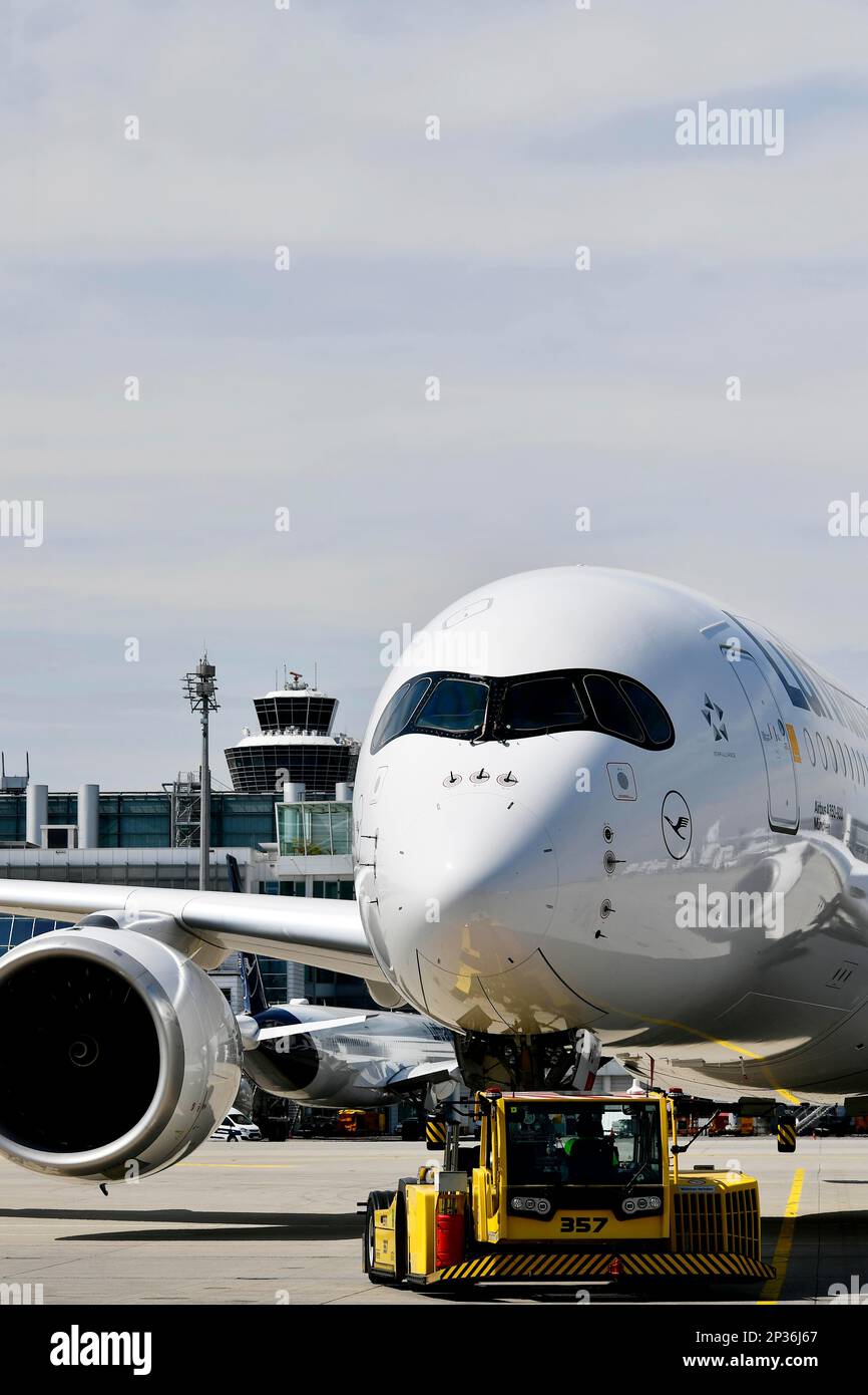 Lufthansa Airbus A350-900 towing with push-back truck in front of ...