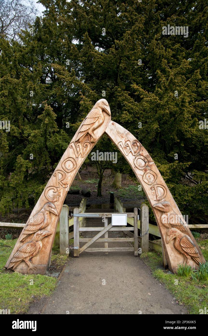 Carved wooden arch at entrance to woodland, Crow Wood, Danby, North ...