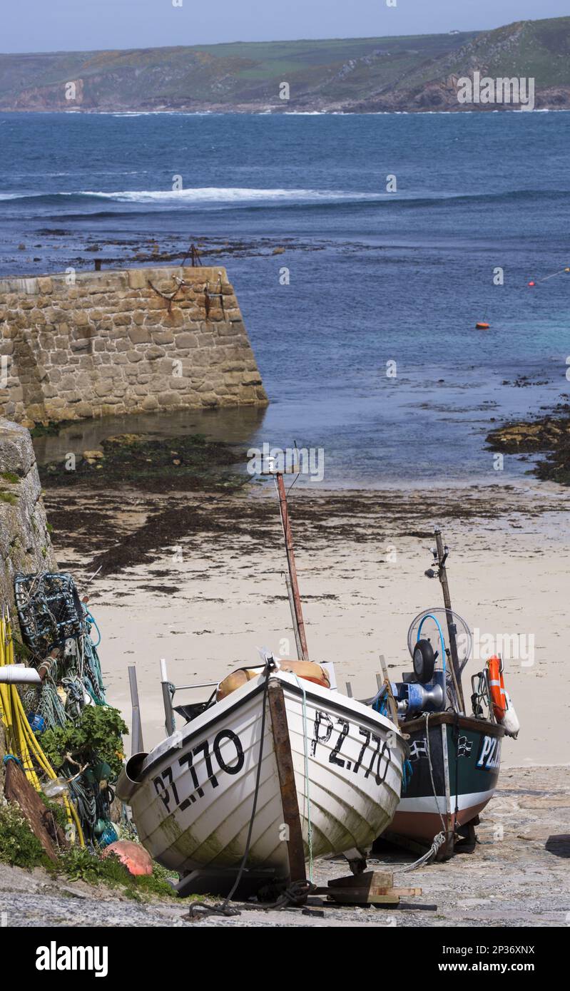 Fishing boats moored in the harbour of a coastal village, Sennen Cove ...