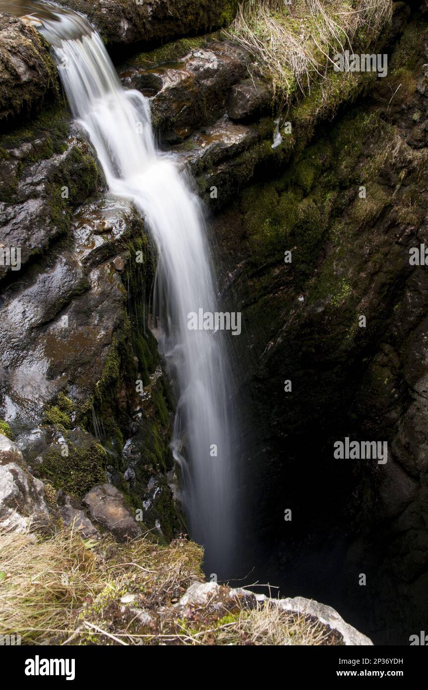 High mountain stream flowing into the abyss, Fell Beck, Gaping Gill ...