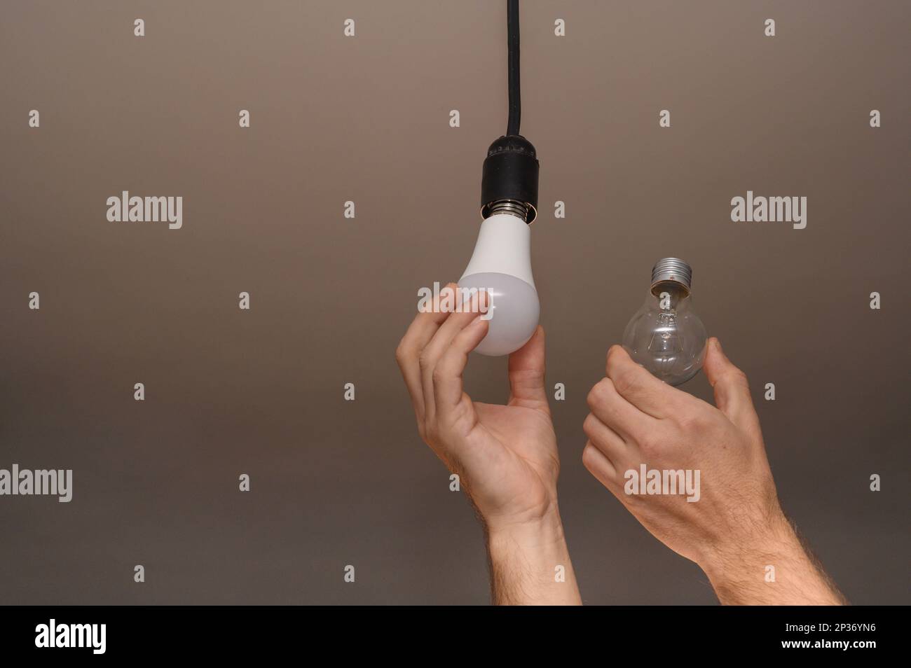 Hand changing light bulb close hi-res stock photography and images - Alamy