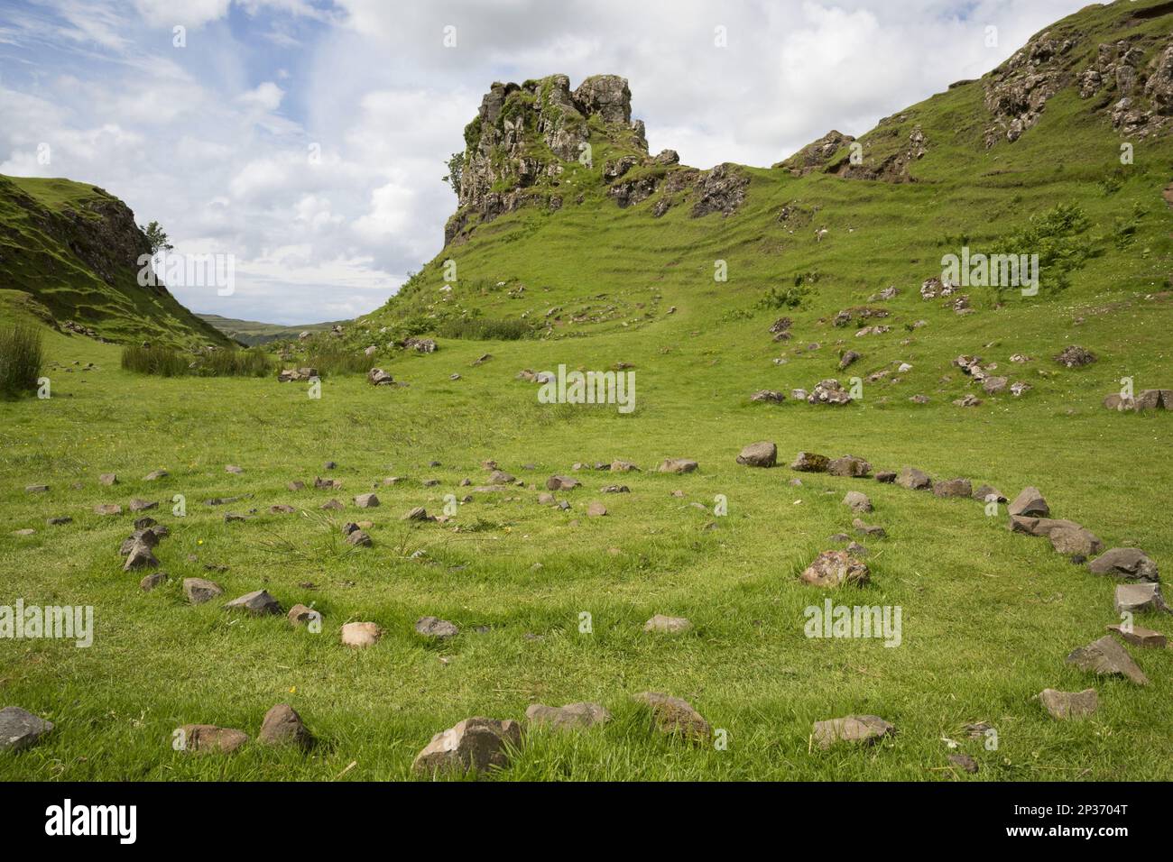 View of stone circle and rock outcrop 'tower' formation, Castle Ewen ...