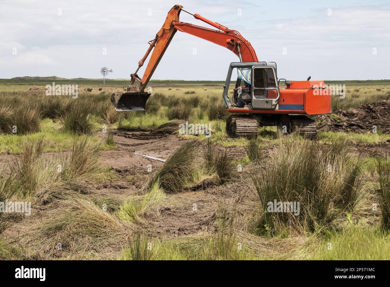 Using a backhoe to restore habitat at Deepdale Marsh, Burnham Deepdale ...