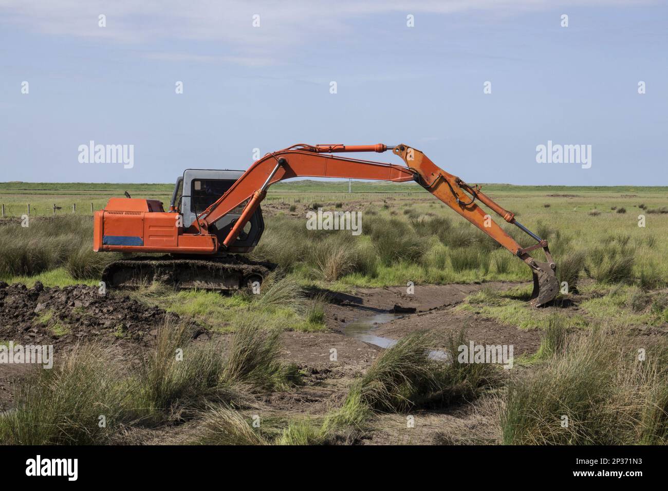 Using a backhoe to restore habitat at Deepdale Marsh, Burnham Deepdale ...