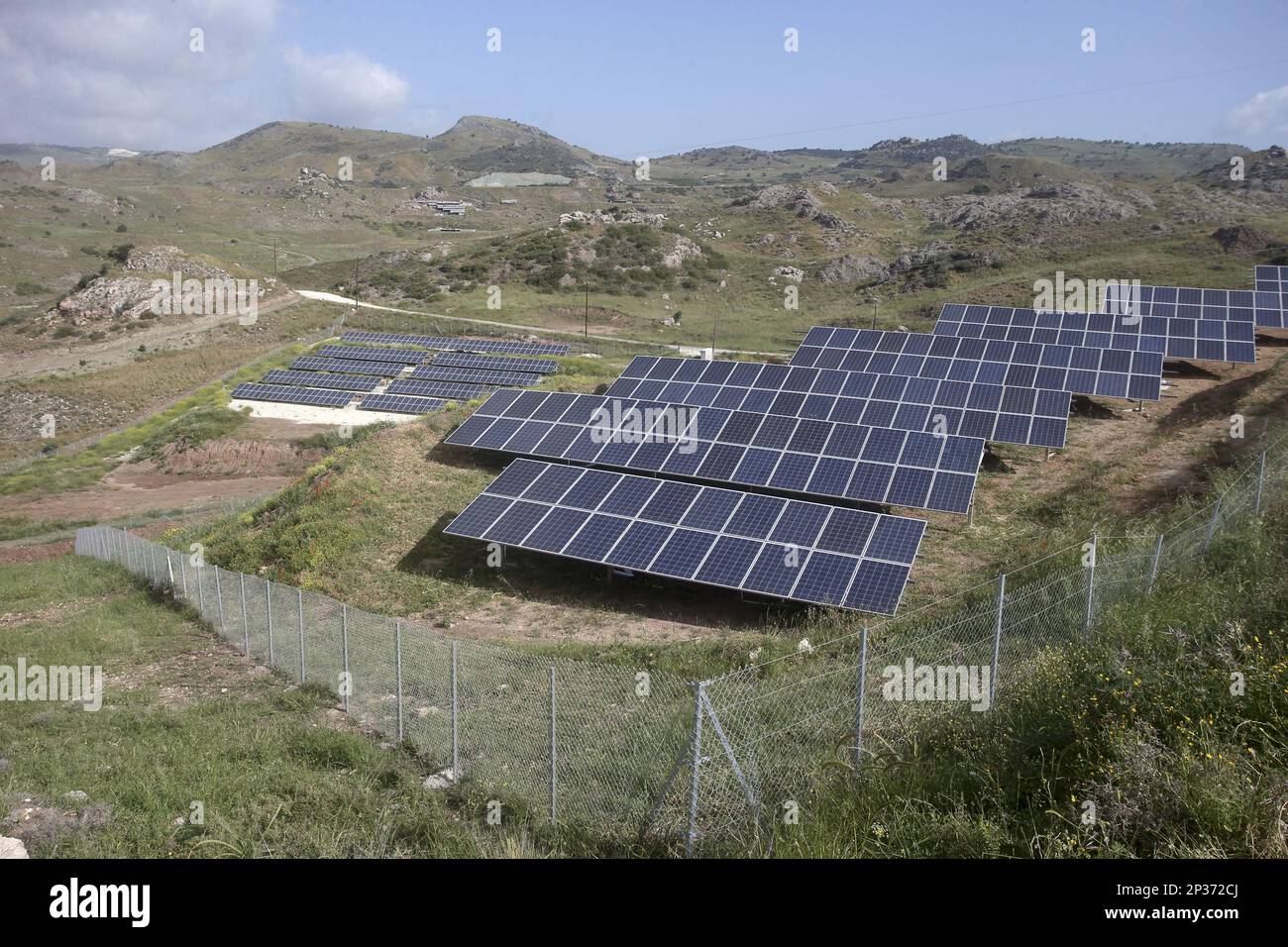 Solar panels in field on hillside, Cyprus Stock Photo - Alamy