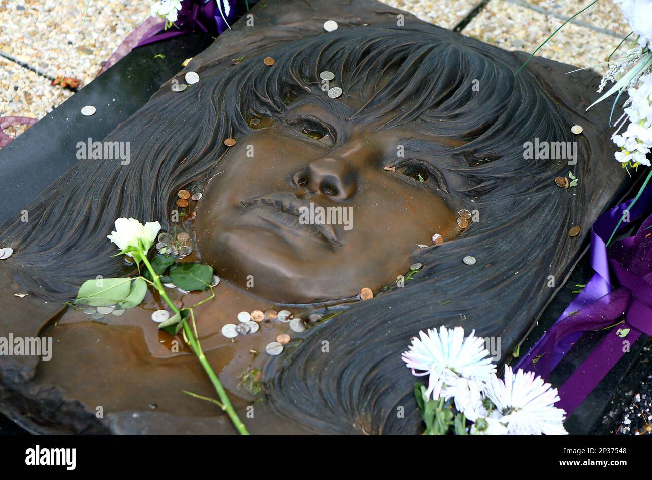 Flowers and coins are left at Selena's gravesite Thursday April 16 ...